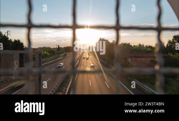 A 4K video time lapse of the highway at sunset shot from the overpass ...