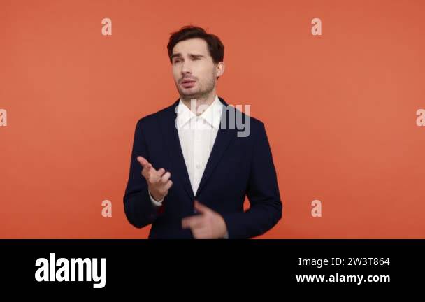 Portrait of young bearded accountant wearing black official style suit ...