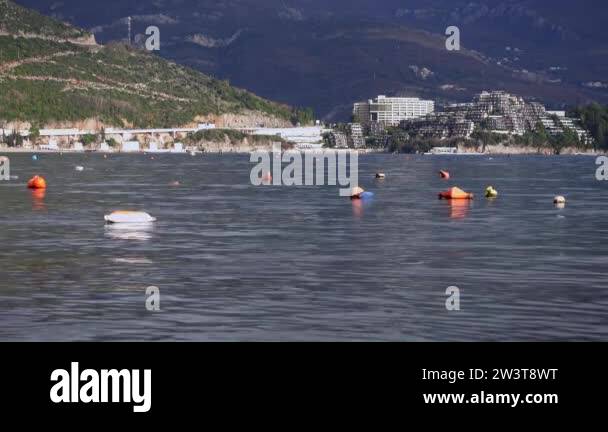 Bright buoys float on surface of water marking dangerous depth for ...