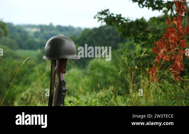 Memorial battlefield cross. Symbol of a fallen US soldier. M1 rifle ...