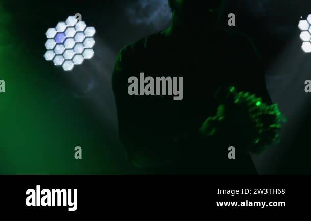 Ethnic black musician plays the African Shekere rhythm instrument and ...