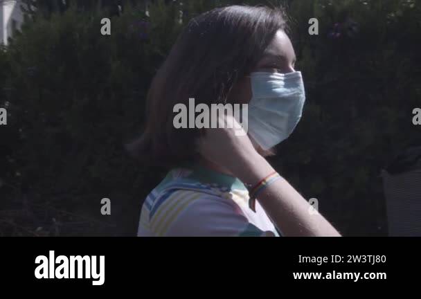 video of young teenage girl taking off her face mask after the covid 19 ...