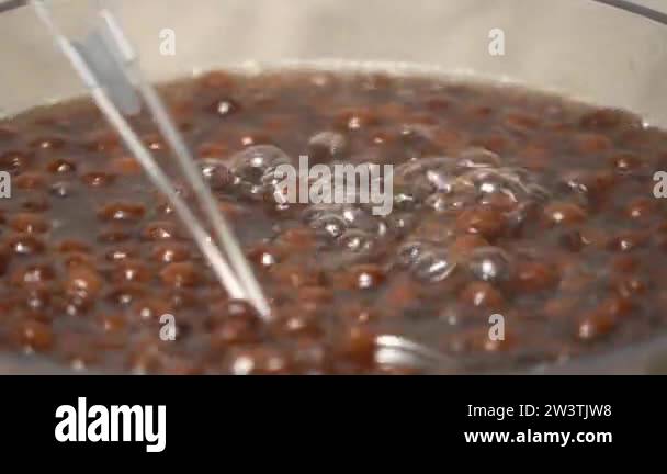 Cooking, boiling brown sugar flavor tapioca pearl balls, ingredient of ...