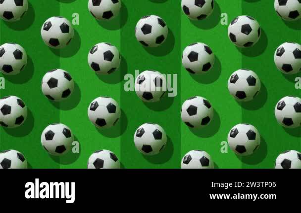 Background from large group of soccer balls. Balls rotate around their ...