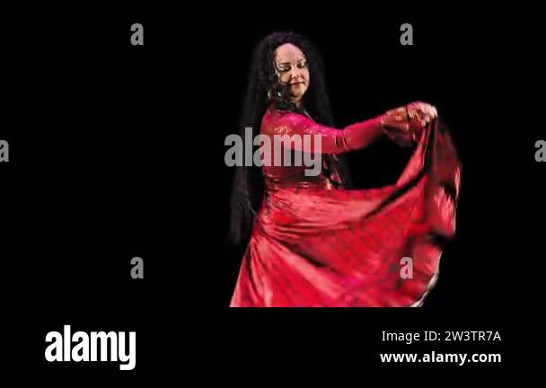 A barefoot gypsy woman without a face with long black hair in a red ...