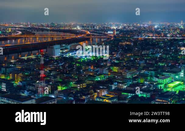 time lapse of cityscape and highway road bridge in Tokyo at night ...