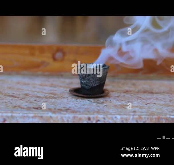 Dhoop wooden stick is burned to produce a pleasant smell for part of a ...