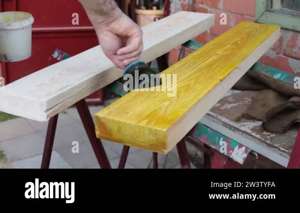 Preparation of boards for construction, men's hands work with wooden ...