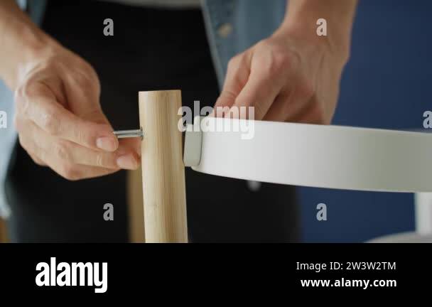 Close up video of installing furniture with an Allen key. Shot with RED ...