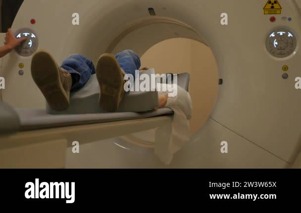 close-up footage of person in Magnetic resonance imaging (MRI) machine ...