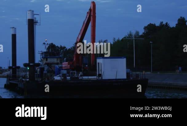 Construction Barge With Excavator On The Board Swims Into The Harbor ...