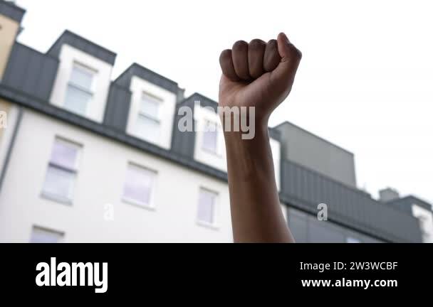 The raised fist or the clenched fist is a hand gesture symbol of ...