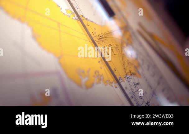 Plotting position on navigational chart at sea. Marine Map and ruler ...