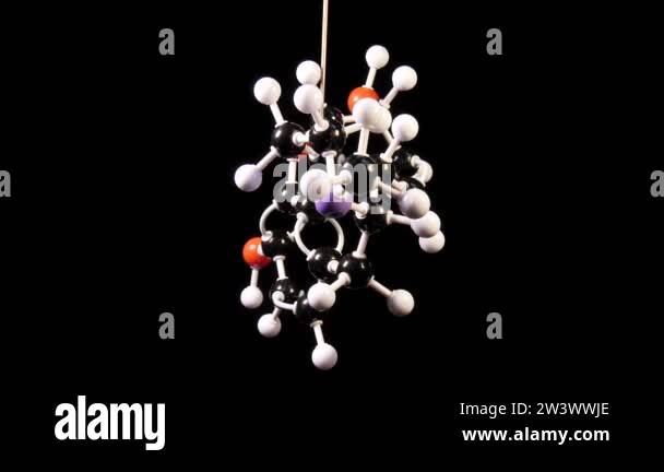 Chemical Formula of a molecule rotating isolated on a black background ...