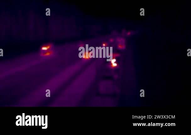 Thermal imaging view of highway road with moving cars. Infrared ...