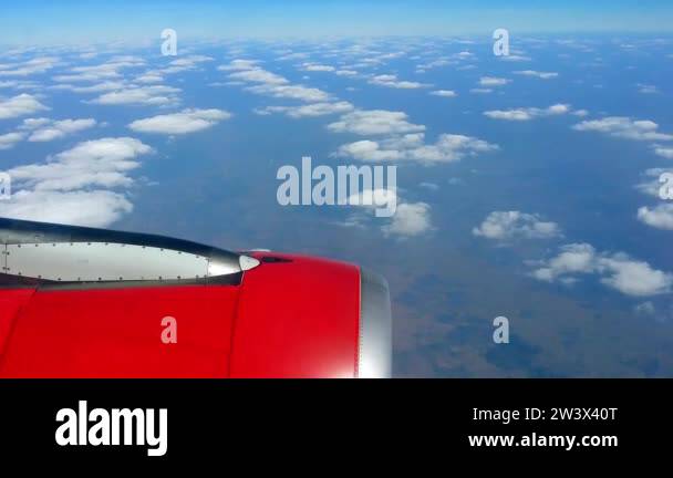 Airplane flies above the clouds. Jet turbine engine through the ...
