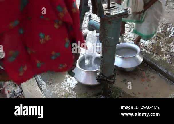 Woman buckets water Stock Videos & Footage - HD and 4K Video Clips - Alamy