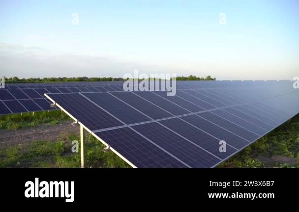 Solar panels stands in row on the ground . Free electricity for home ...
