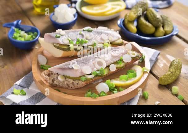 Dutch herring. Toast with Dutch herring, onions, pickles. Traditional ...