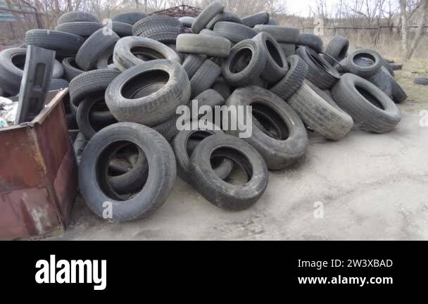 a mountain of old tires. dump of used wheels. Industrial landfill for ...