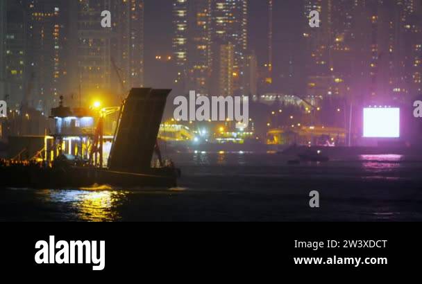 Night view of port harbor at night with cargo ships and boats float on ...