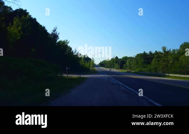 Viewpoint of Multiple Vehicles on Rural Street From Side of Road in ...