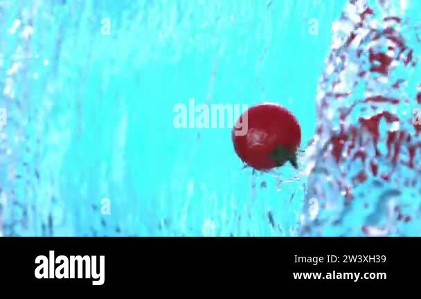 Ripe Cherry Tomatoes Falling into Water Splash Cascade in Slow Motion ...