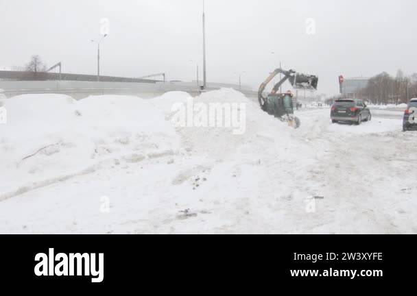 Snow removal equipment working after a heavy snowfall in the area of ...