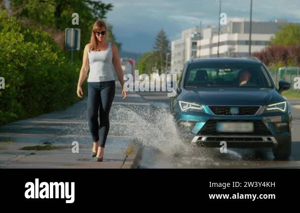 Car puddle pedestrian Stock Videos & Footage - HD and 4K Video Clips ...