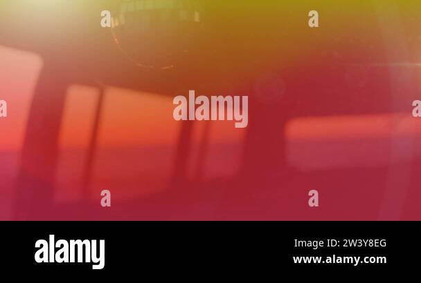 Animation of mirror ball moving in wind with yellow to red hue with ...