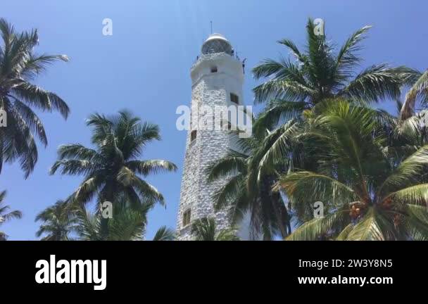 Dondra Head Lighthouse in between the palmtrees at the most Southern ...