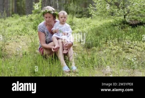 Little girl at age of one year gets to know world. Portrait of little ...
