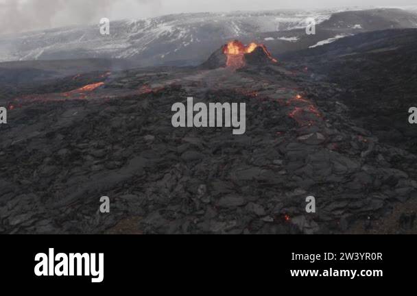 People standing close to active volcano aerial view, Mount ...