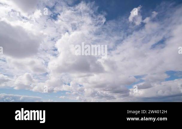 Blue sky white clouds. Puffy fluffy white clouds. Cumulus cloud cloudscape timelapse. Summer ...