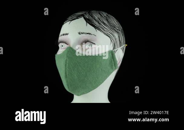 Woman doll head in protective medical face mask rotation, New Normal ...