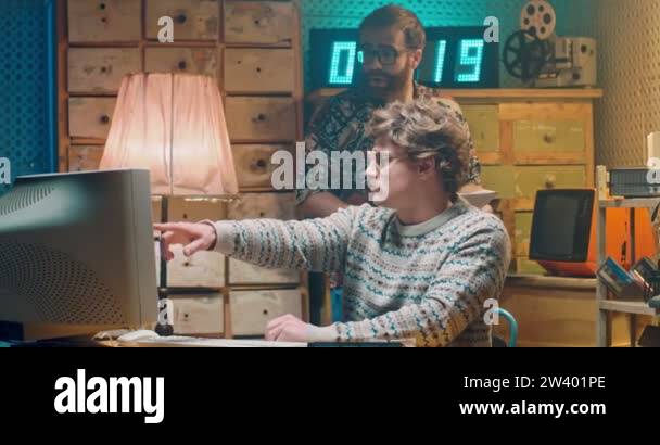 Caucasian man nerd from 70s working at old computer vintage monitor and ...