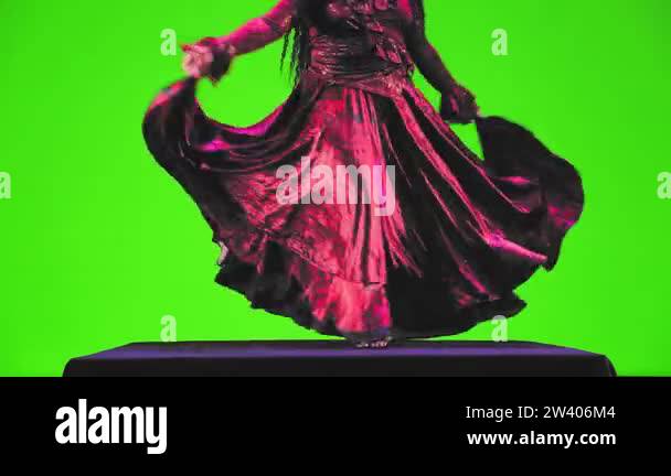 A barefoot gypsy woman without a face with long black hair in a red ...