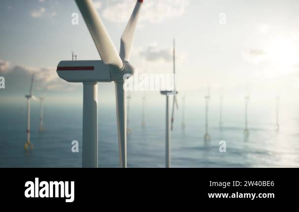 Energy Windmill farm in the ocean. Offshore Windmill farm in the sea ...