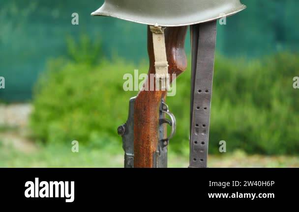 Memorial battlefield cross. Symbol of a fallen US soldier. M1 rifle ...