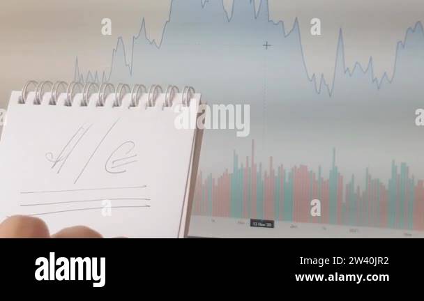A female trader analyzes price charts when trading on the stock ...