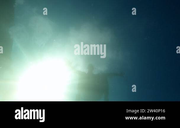 Man jumps into the water. Shooting from under water. Jumping into the ...