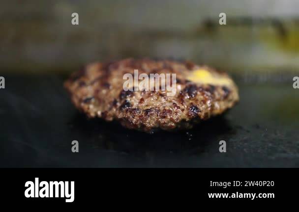 Burger meat cutlet frying on hot pan in restaurant kitchen for dinner ...