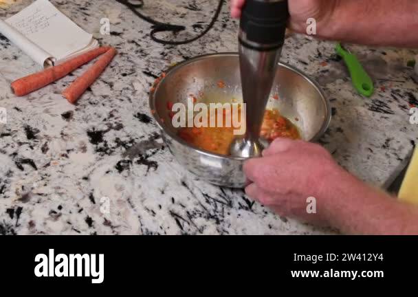 Male Hands Mix a Salad Dressing Recipe with an Immersion Blender ...