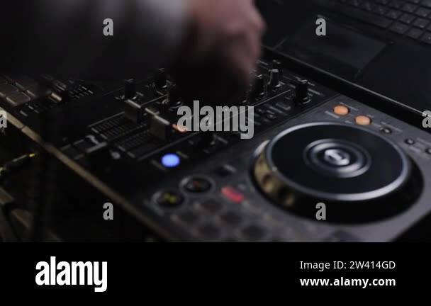Mixer controller composing new mix on vinyl plate. DJ sound control ...