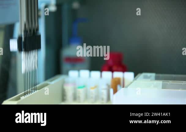 Automation in the clinical laboratory. Pipetting robot laboratory. Medicine robotics. Research ...