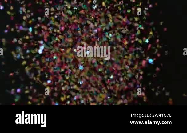 Close up Confetti explosion on black background. Slow Motion confetti ...