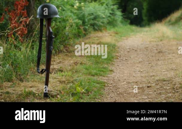 Memorial battlefield cross. Symbol of a fallen US soldier. M1 rifle ...
