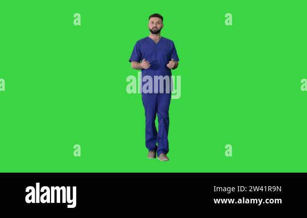 Male doctor surgeon talking while walking on a Green Screen, Chroma Key ...