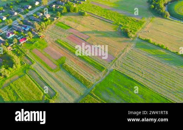 Bird's-eye aerial view of a summer rural village landscape country with ...
