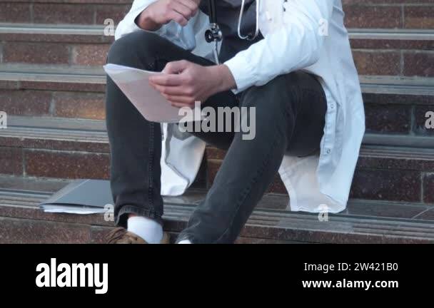 Cardiologist holding and review electrocardiograph EKG or ECG diagram ...